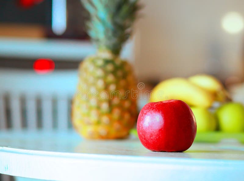 Red Apple, Diverse Fruits on a Table in a Modern Kitchen. Useful ...