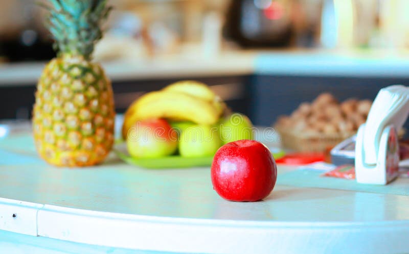 Red Apple, Diverse Fruits on a Table in a Modern Kitchen. Useful ...