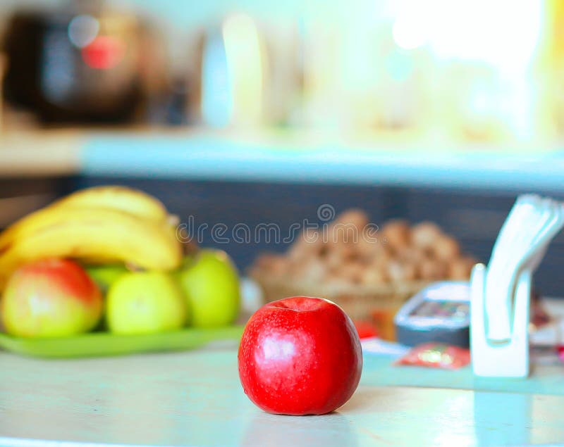 Red Apple, Diverse Fruits on a Table in a Modern Kitchen. Useful ...