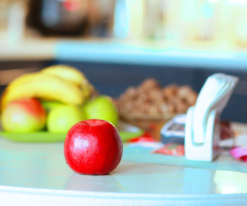 Red Apple, Diverse Fruits on a Table in a Modern Kitchen. Useful ...