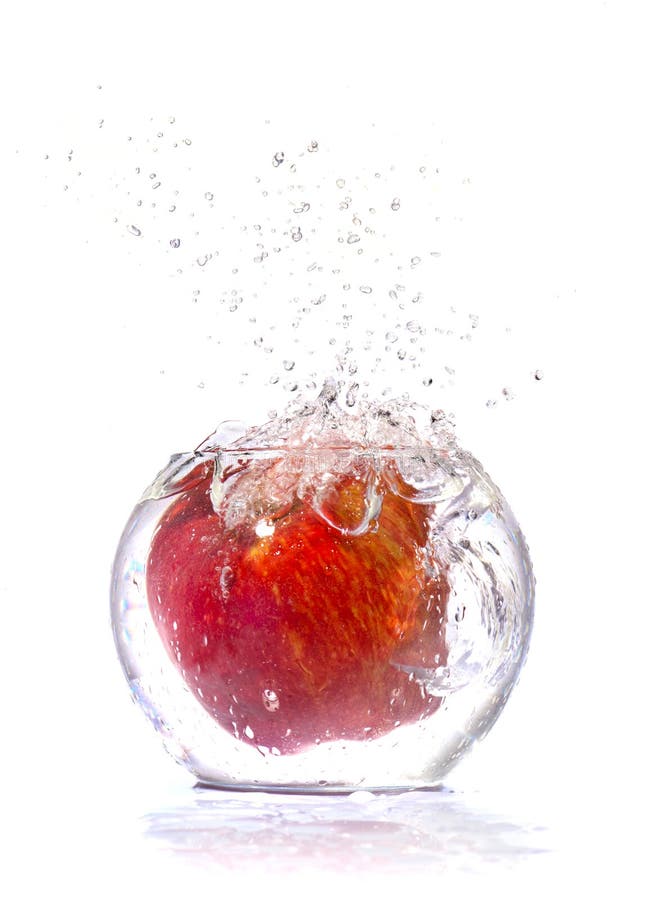 Red apple falls in water stock photo. Image of blur, drop - 24123936