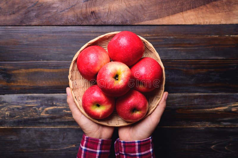 Red Apple Fruit in Basket Holding by Hand, Top View Stock Photo - Image ...
