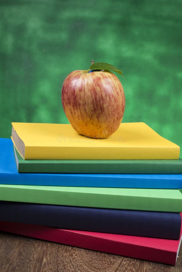 Apple Fruit on Top of a Book Stack, on the Back of School Classes Stock ...