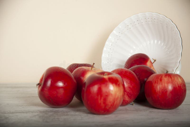 A Red Apple Full of Vases on the Table. Stock Photo - Image of table ...