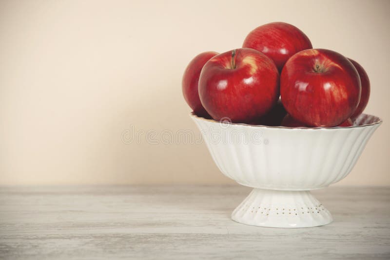 A Red Apple Full of Vases on the Table. Stock Photo - Image of table ...