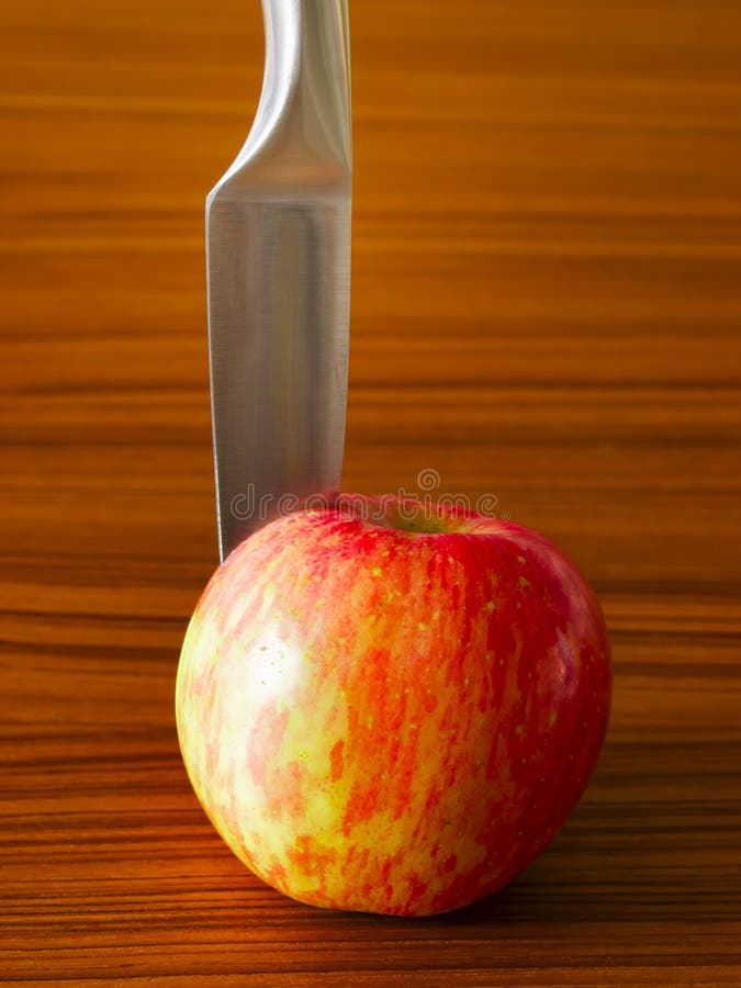 Red apple with knife stock image. Image of pierce, knife - 19539833