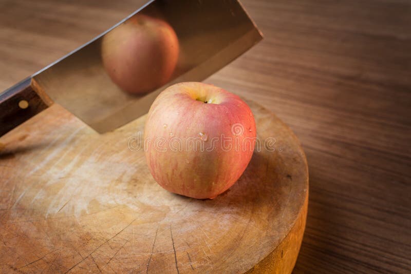 Red Apple and Knife on Wooden Cutting Board Stock Image - Image of ...