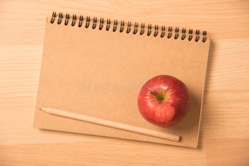 Red Apple on Notebook with a Pencil Stock Image - Image of book, apple ...