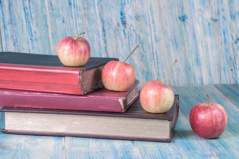 Red apple on old book stock photo. Image of fruit, book - 62869724