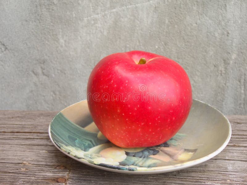 Red apple on plate stock photo. Image of card, eating - 33272444