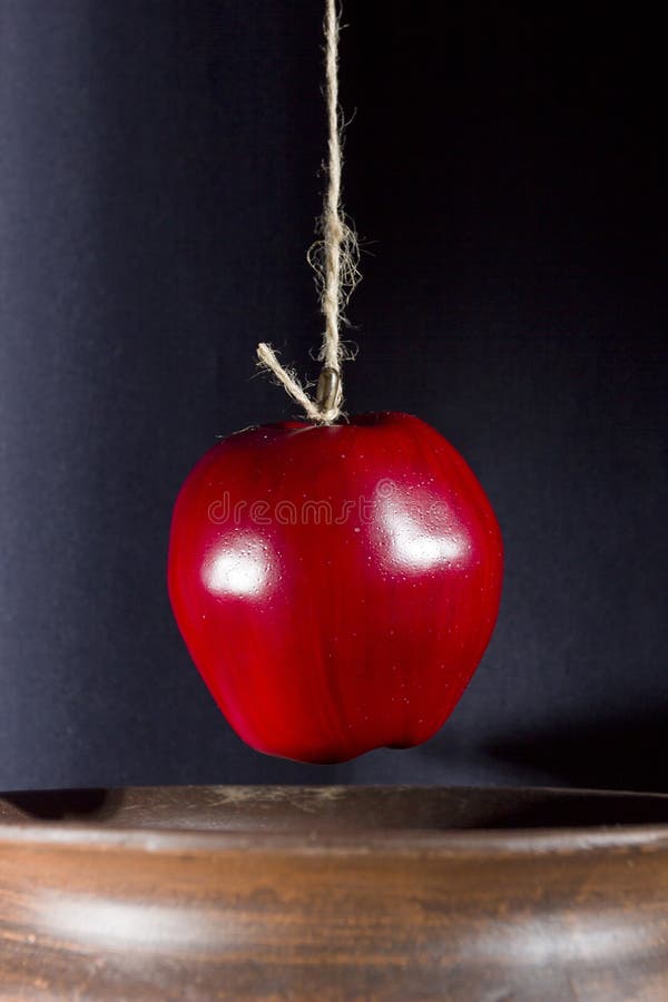Apple on the Rope is Lowered into a Pot Stock Photo - Image of rope ...