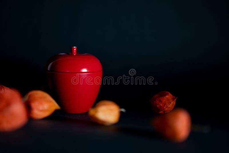 Red, Apple-shaped Candle Isolated on Black Stock Image - Image of ...
