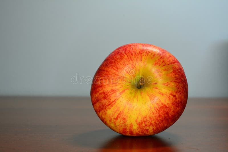 Red Apple Showing Radiation Pattern on Tabletop Stock Image - Image of ...