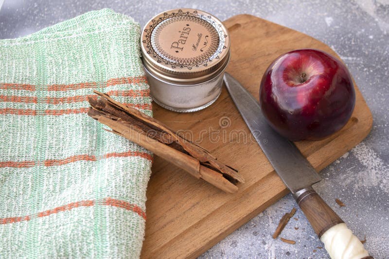 Red Apple, Sugar, Cinnamon Stick, Kitchen Rag and Wood Table Over ...