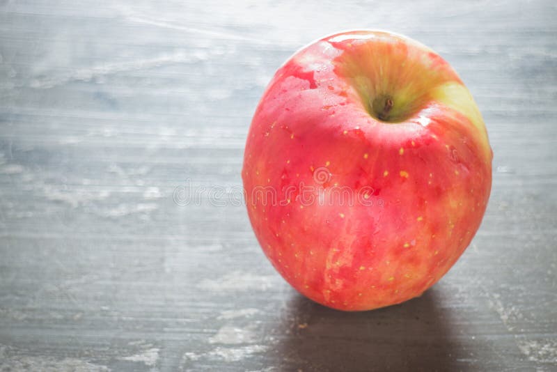 Red apple on the table stock image. Image of nutriment - 56002797
