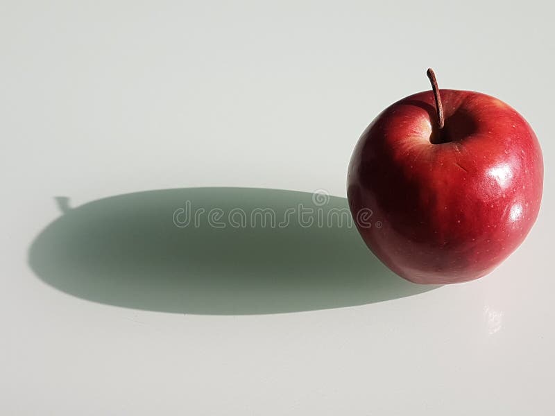 Red Apple on the Table at Sunrise Stock Photo - Image of sunrise, table ...
