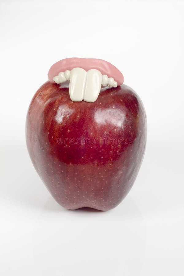 Red apple and teeth stock photo. Image of sink, delicious - 1869234