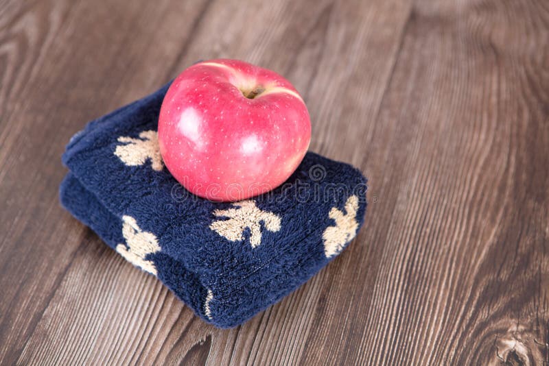 A red apple on a towel stock image. Image of edible - 229209665