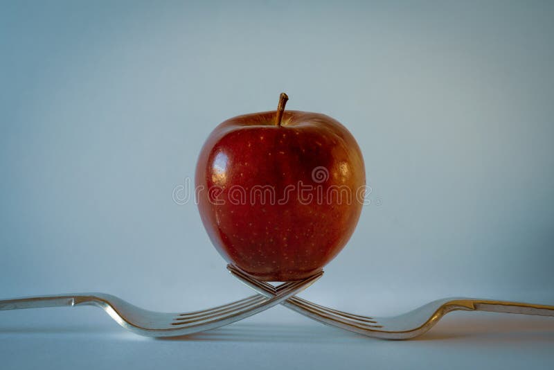 Apple on two forks stock photo. Image of shell, nourish - 178314968