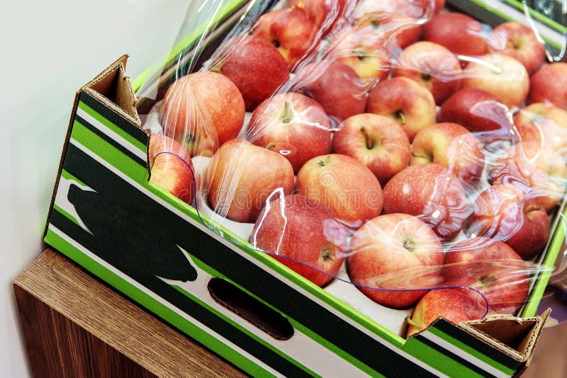 Red Apples in a Cardboard Box Packed with Polyethylene. Export of ...