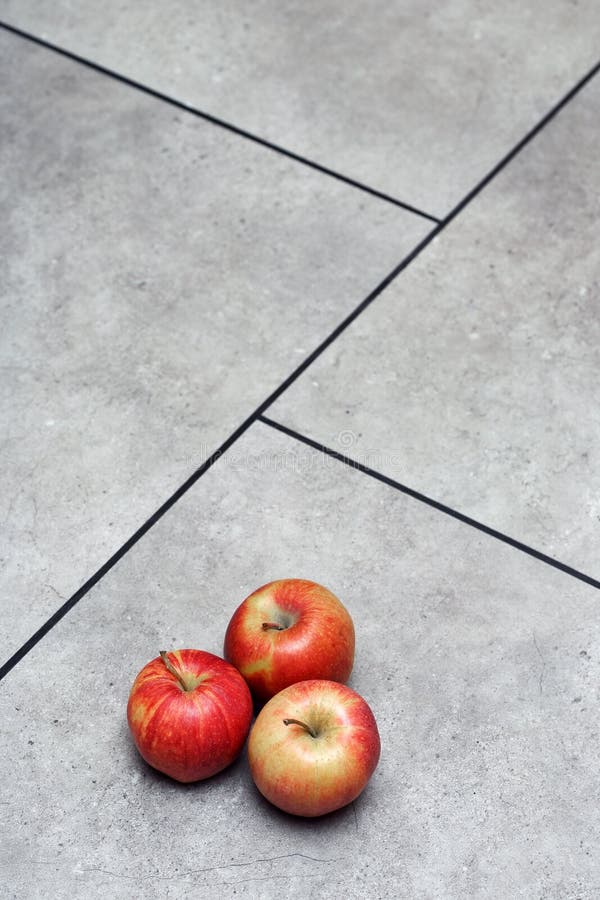 Red Apples, on Grey Floor Tiles Stock Image - Image of grey, black ...