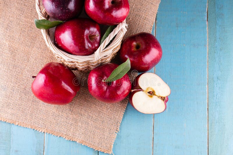 Red Apples with Leaves on the Table Stock Photo - Image of overhead ...