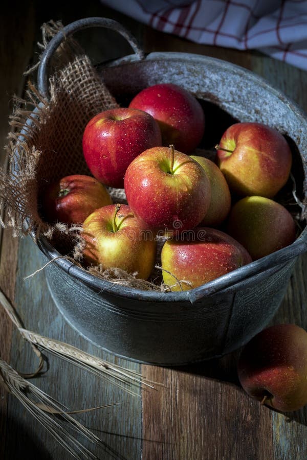 Red Apples in an Old Bowl on a Wooden Table Stock Photo - Image of ...
