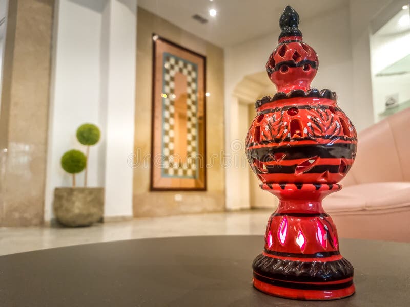 Red Arabic lamp on a table stock photo. Image of carving - 277050804