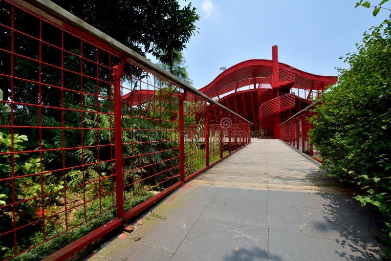 Red Architecture and Path in Green Environment Stock Photo - Image of ...