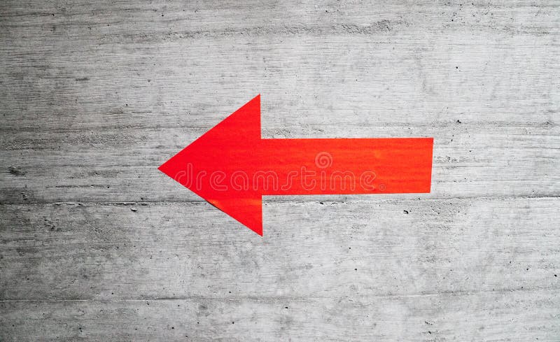 Red Arrow on a Gray Concrete Wall Pointing To the Left Stock Image ...