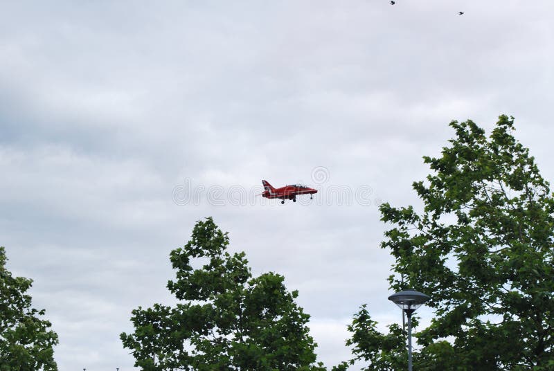 Red Arrows - landing editorial stock photo. Image of aircraft - 221863933