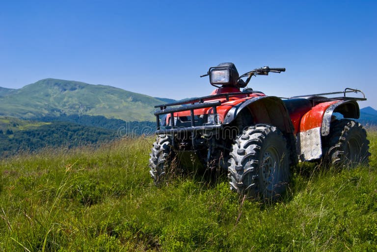Red atv on highlands- quad stock image. Image of terrain - 6511505