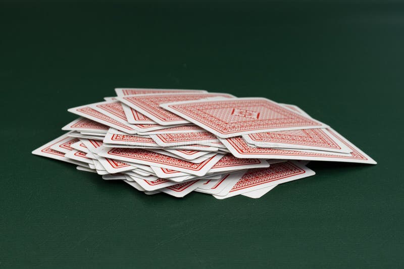 Red Back Playing Cards Deck Spread on Green Table Stock Photo - Image ...