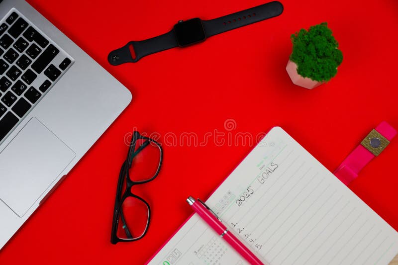 On a Red Background with a Slant Lie a Pink Diary Notebook in Which it ...