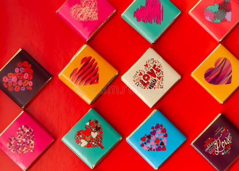 On a Red Background are Staggered Small Square Chocolate Bars Stock ...