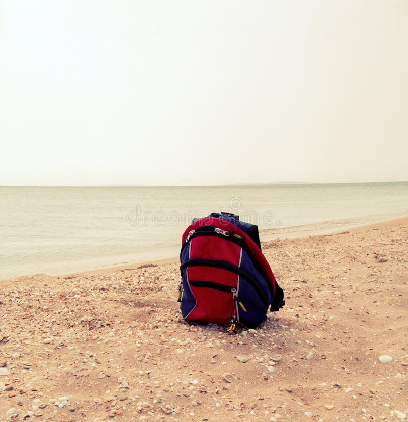 Red Backpack on the Sandy Sea Beach, a Lot of Copyspace Stock Image ...