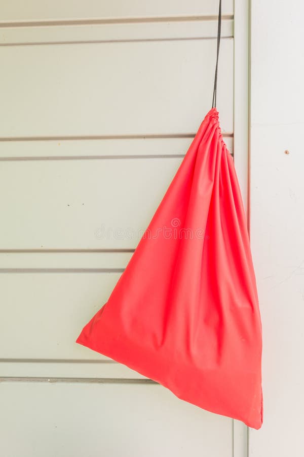 Red bag on the wall stock photo. Image of background - 59057276