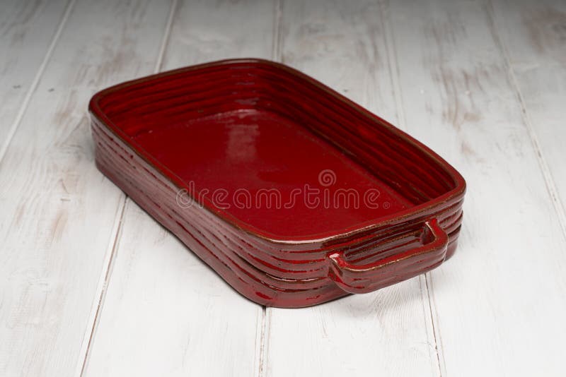 Red Baking Dish on White Wooden Panel Surface Stock Image - Image of ...