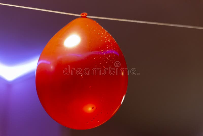 A Red Balloon Hanging on a Thread and Wet Stock Photo - Image of baloon ...