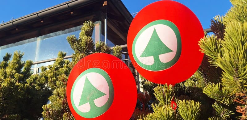 Red Balloons with the Eurospar Logo are Placed on a Fir Tree in Front ...