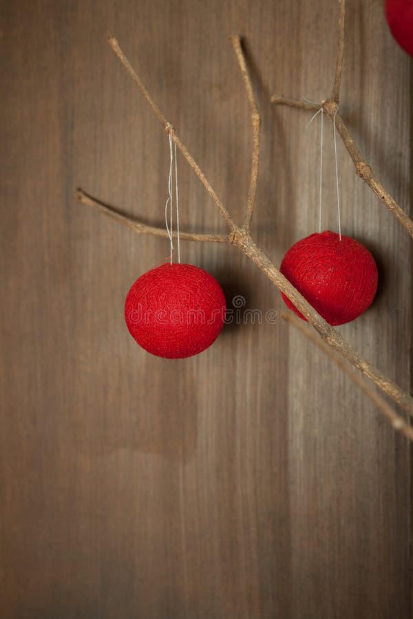Red Balls of String on Branch on Neutral Wall Stock Photo - Image of ...