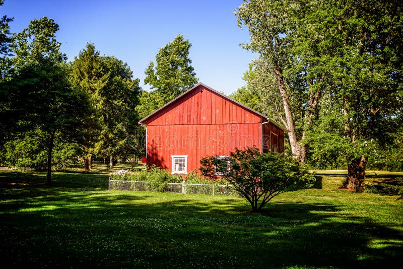 Red Barn with Fenced in Garden Stock Image - Image of barn, cultivated ...