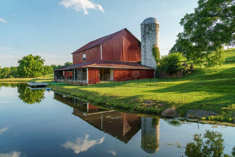 Red Barn and Grain Silo Reflected in a Pond on a Summer Day Stock Photo ...