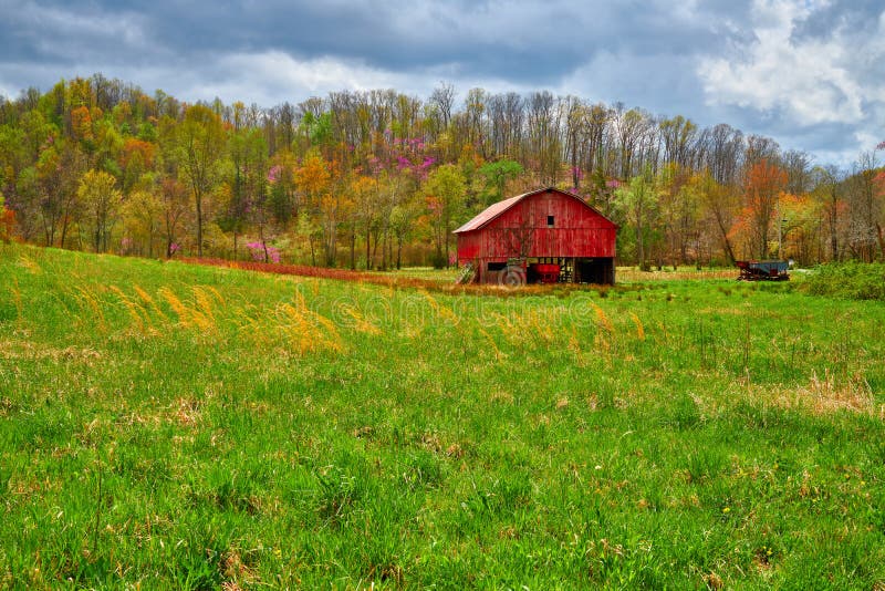 Red barn in hay field stock photo. Image of greens, hill - 15416260