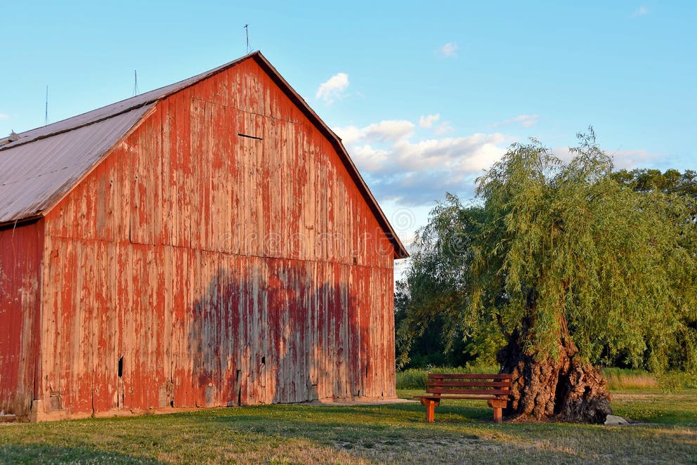Red barn with tree shadow stock image. Image of barn - 65114683