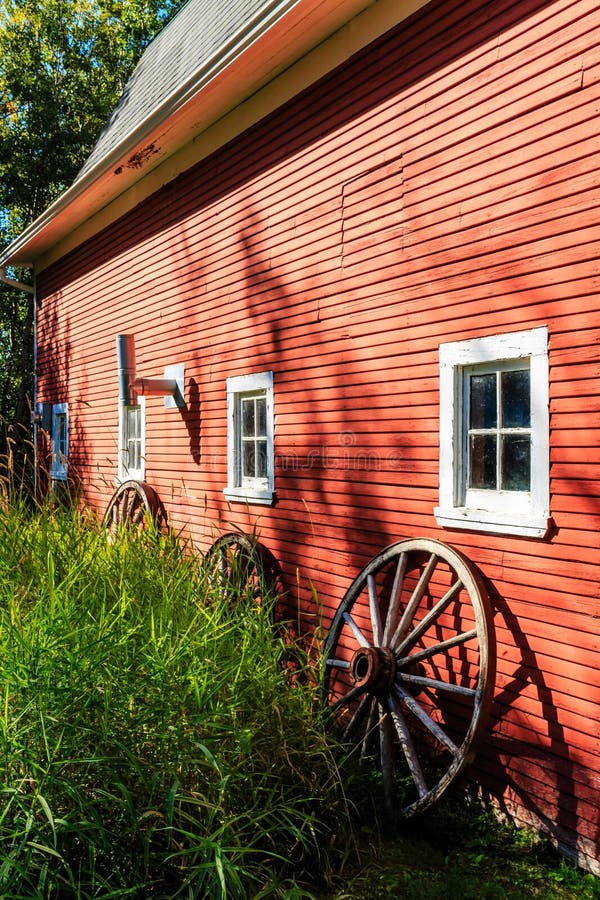 A Red Barn with a Wheel on the Side Stock Photo - Image of tourism ...