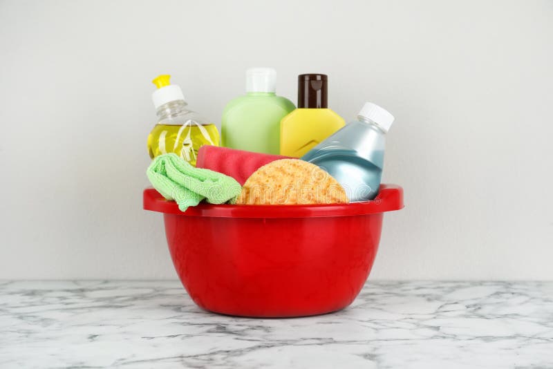 Red Basin with Cleaning Products on Table Stock Image - Image of marble ...
