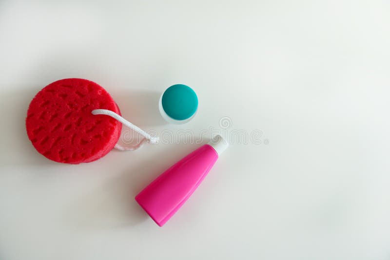 Red Bath Sponge and Cosmetics Bottles Isolated on White Background ...