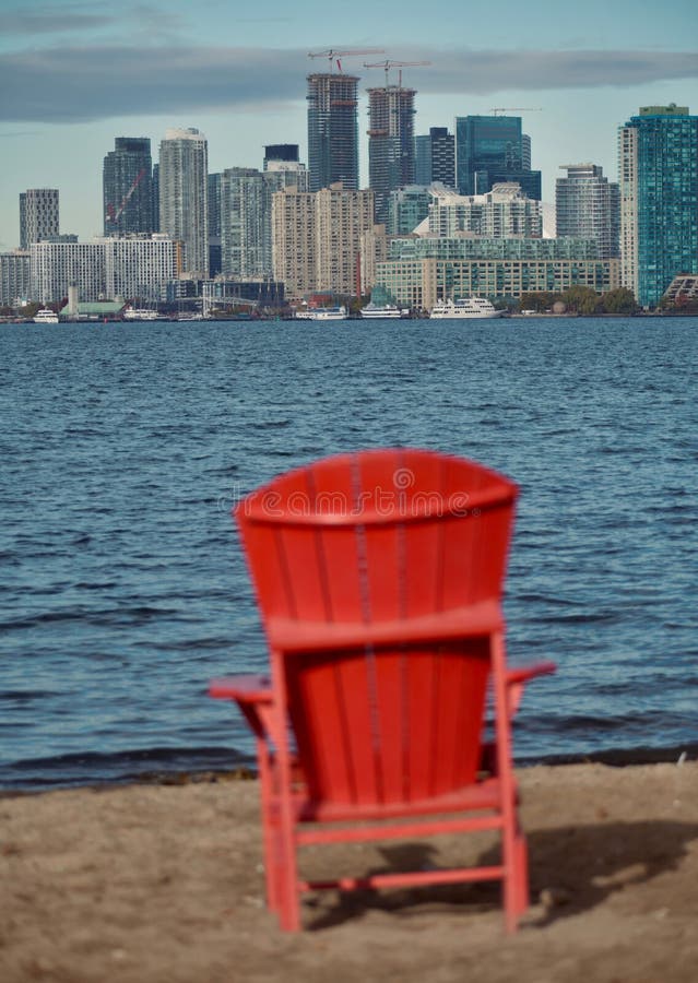 Red Beach Chair Overlooking the Cityscape of Toronto, Canada Stock ...