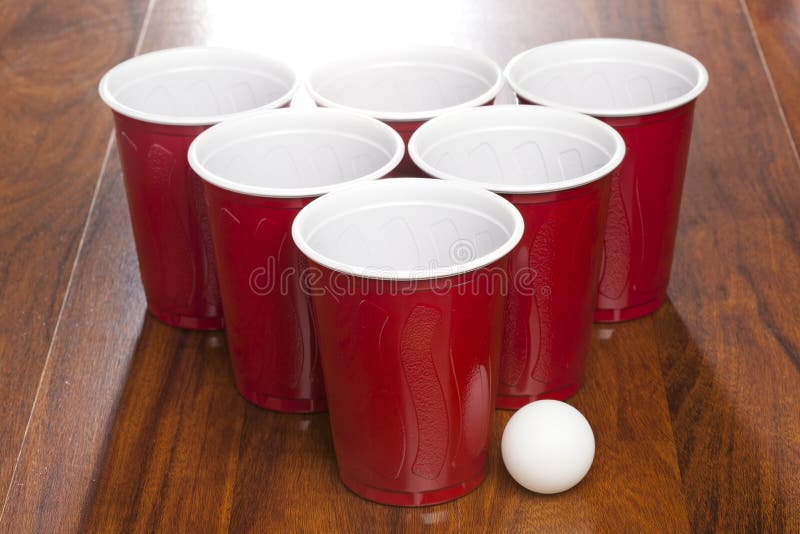Beer Pong Red Plastic Cups And Ping Pong Ball Over Black Stock Image